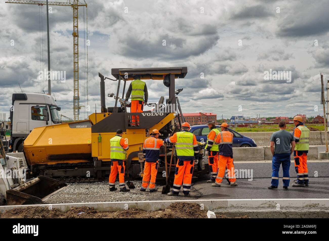 Asphalt road paver paving machine. Tyumen Stock Photo - Alamy