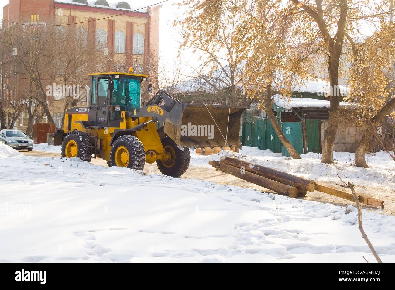 Tractor removes debris from building demolition Stock Photo - Alamy