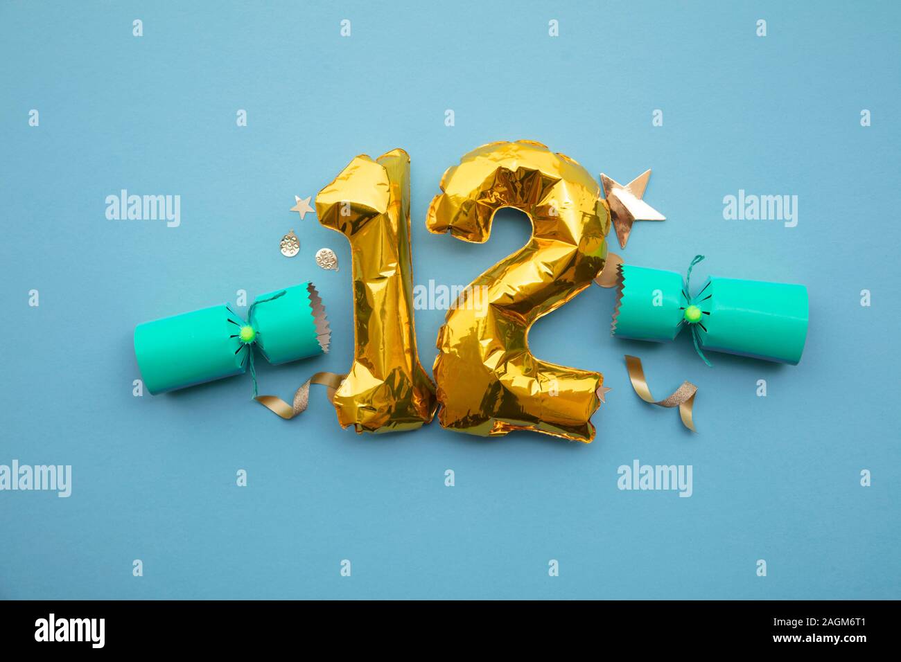 Christmas countdown. Gold number 12 with festive cristmas cracker ...