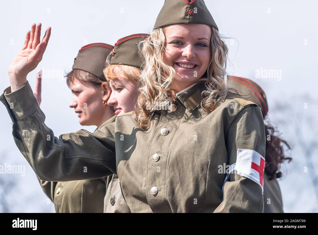 Truck with girls in uniform of times WW2 on parade Stock Photo - Alamy