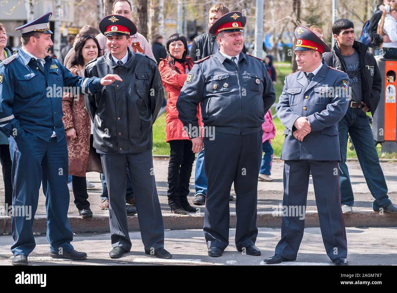 Four policemen stand in cordon Stock Photo - Alamy
