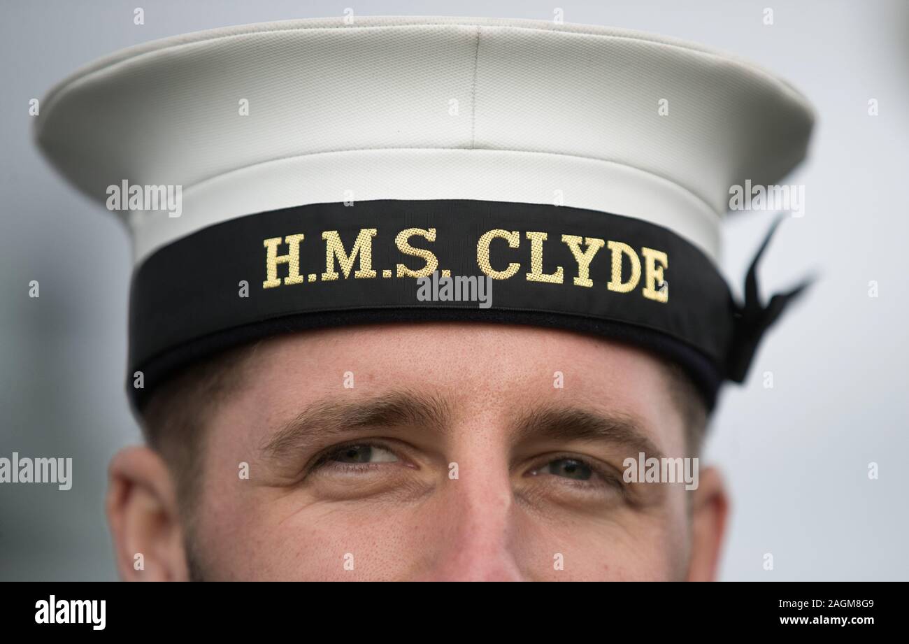 A view of a sailor's cap from HMS Clyde as she arrives back into ...