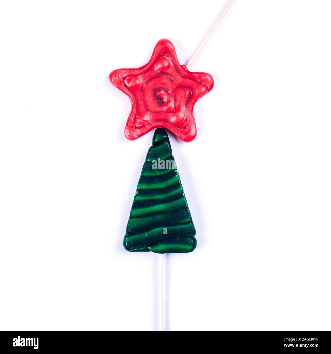Two colorful lollipops as Christmas tree on white background. Bright ...