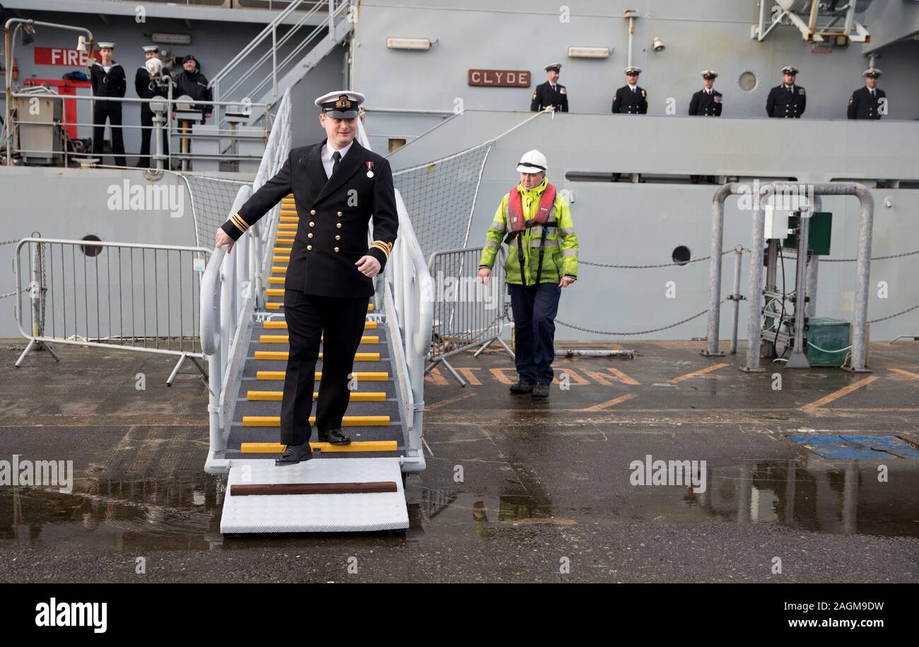 Lieutenant Commander Richard Skelton, Commanding Officer, disembarks ...