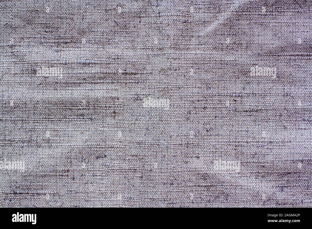 Gray fabric texture with textured stitches. Bulges and bumps in ...