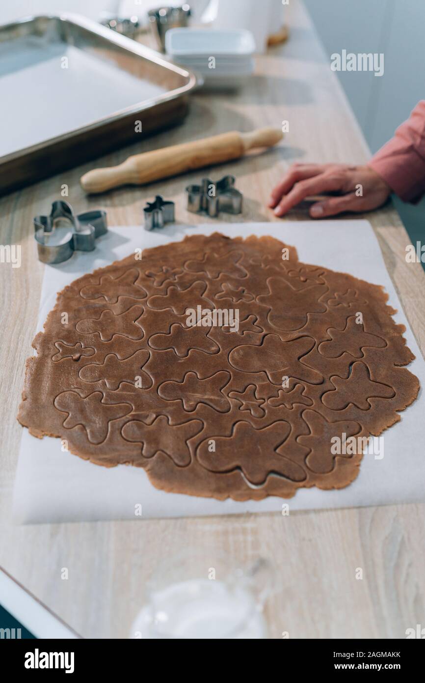 Young woman Making gingerbread cookies. Preparation for Christmas ...