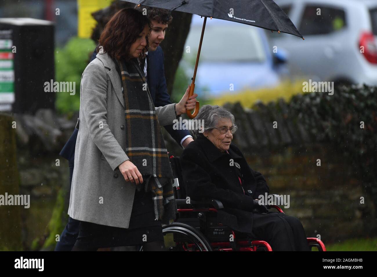 Mourners who travelled in the family cortege arrive at a memorial ...