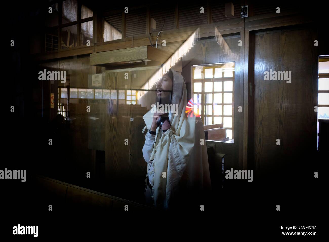 A Jewish settler praying inside the synagogue of Halamish also known as ...