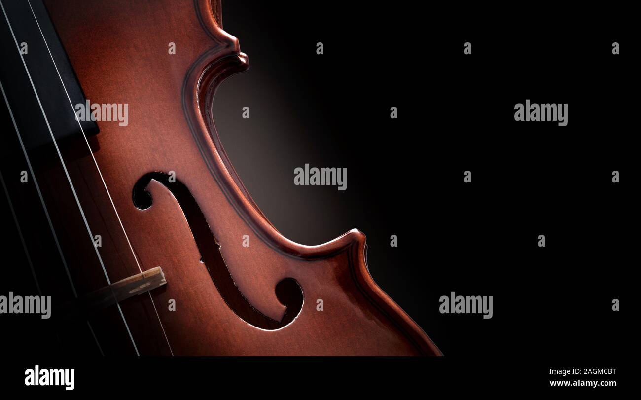 Violin body in the dark with isolated black background. Horizontal ...