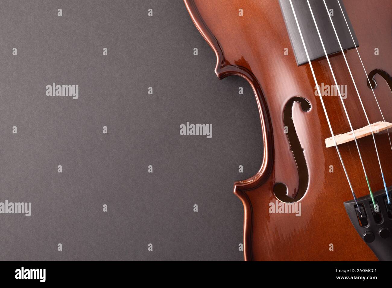 Violin body close up on black table. Top view. Horizontal composition ...