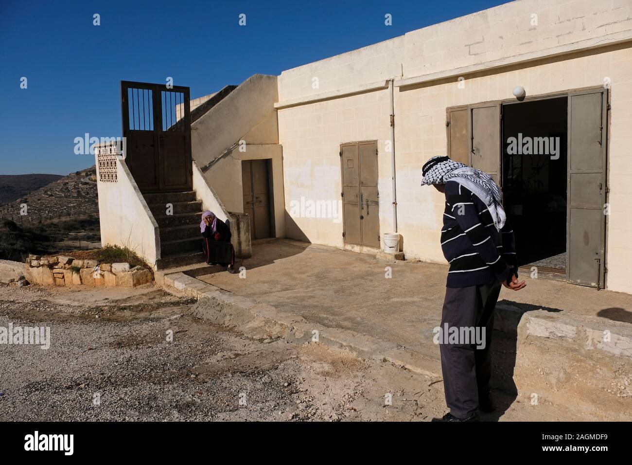 An elderly Palestinian couple at their house near the Jewish settlement ...