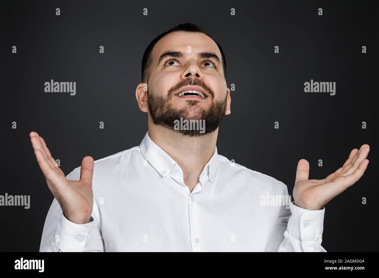 Portrait Of Young Surprised Handsome Bearded Man With Shocked Facial