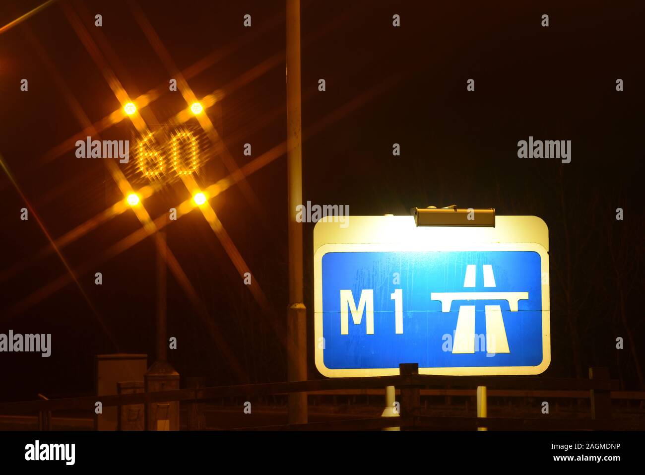 flashing warning sign of 60mph reduced speed limit due to roadworks on M1 motorway leeds united ...
