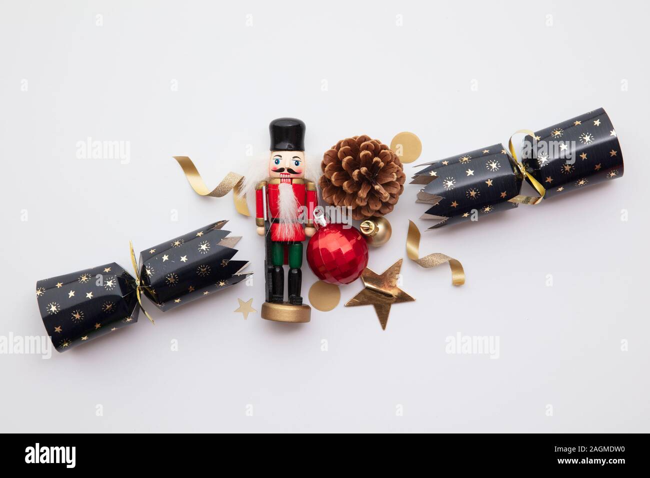 Pulled Christmas cracker full of festive decorations Stock Photo - Alamy