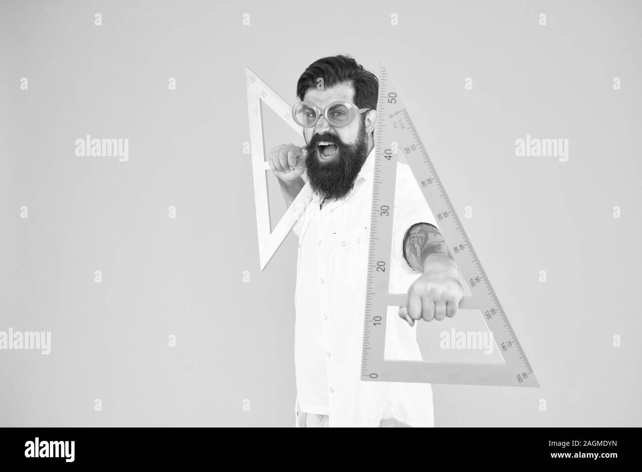 Smart student. Geometry teacher. Student using measuring instrument ...