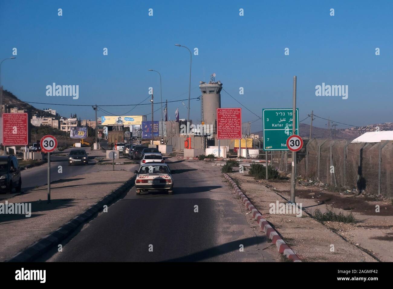 Palestinian cars driving through Huwwara or Huwara checkpoint located ...
