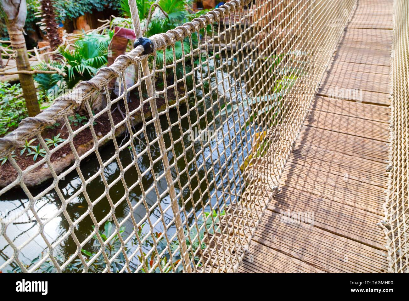 The bamboo rope bridge in jungle close up Stock Photo - Alamy
