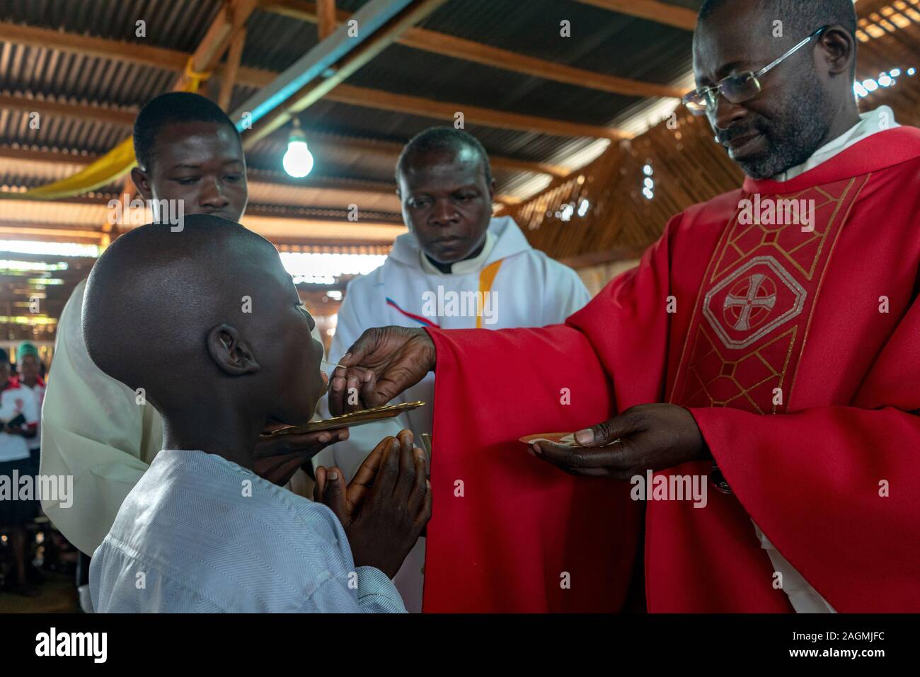 Blessing by the priest Stock Photo - Alamy