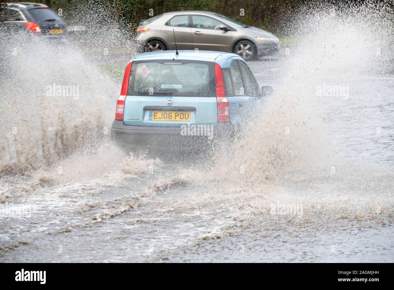 Road traffic on flooded road in heavy rain hi-res stock photography and ...