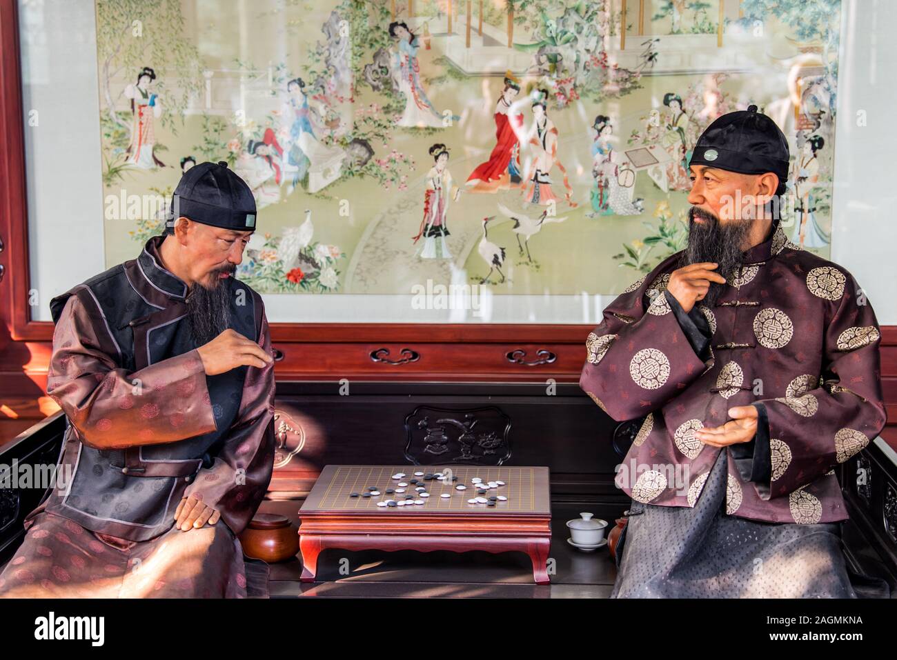 Statue of ancient Chinese men playing weiqi ( go chess) in Qing dynasty ...