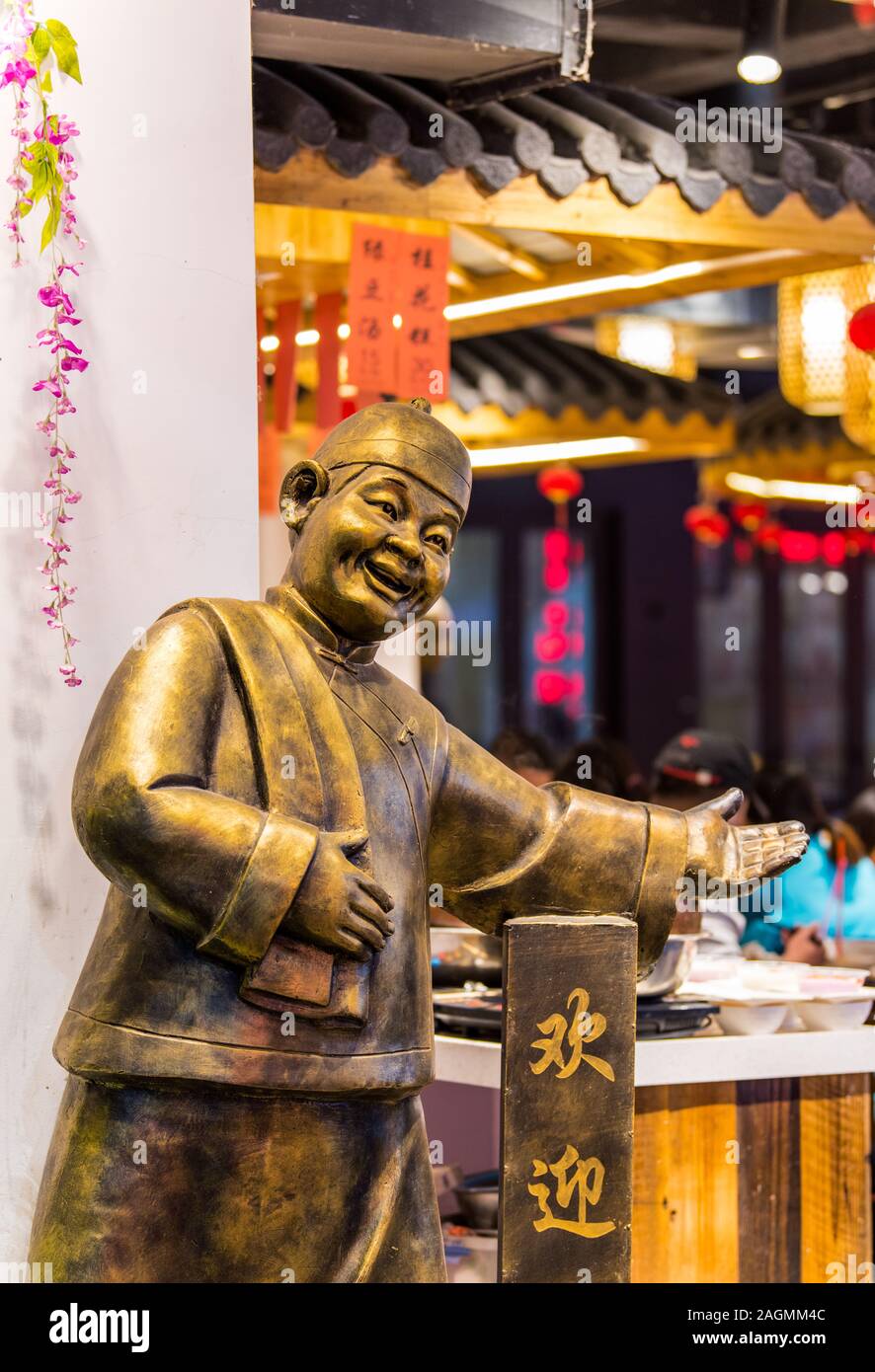 Statue of ancient Chinese waiter at the restaurant near Fuzimiao ...