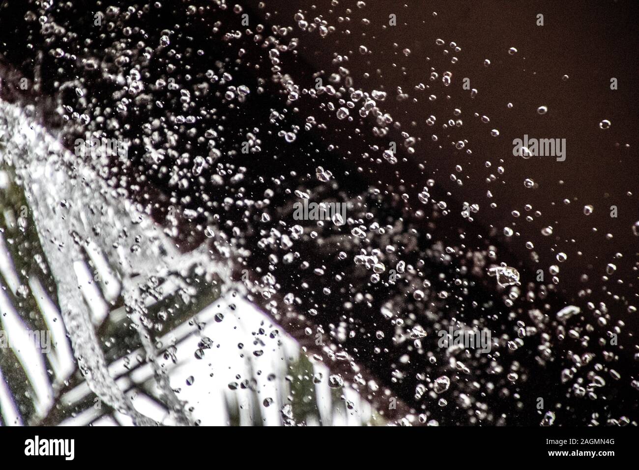 Raindrops falling to the ground during heavy rainfall Stock Photo - Alamy