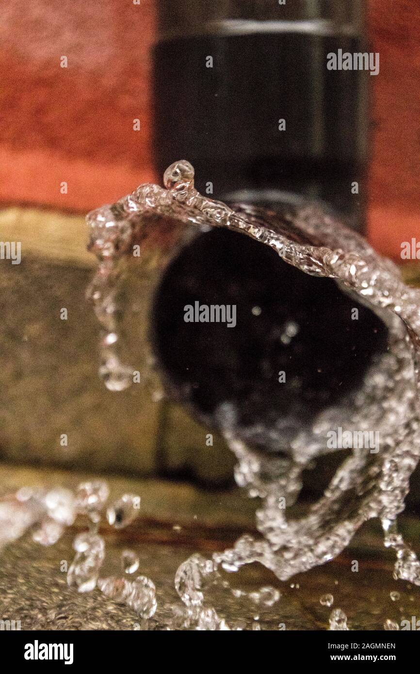 Gutters gush with water from a heavy downpour of rain Stock Photo - Alamy