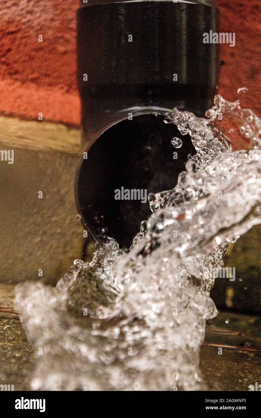 Gutters gush with water from a heavy downpour of rain Stock Photo - Alamy