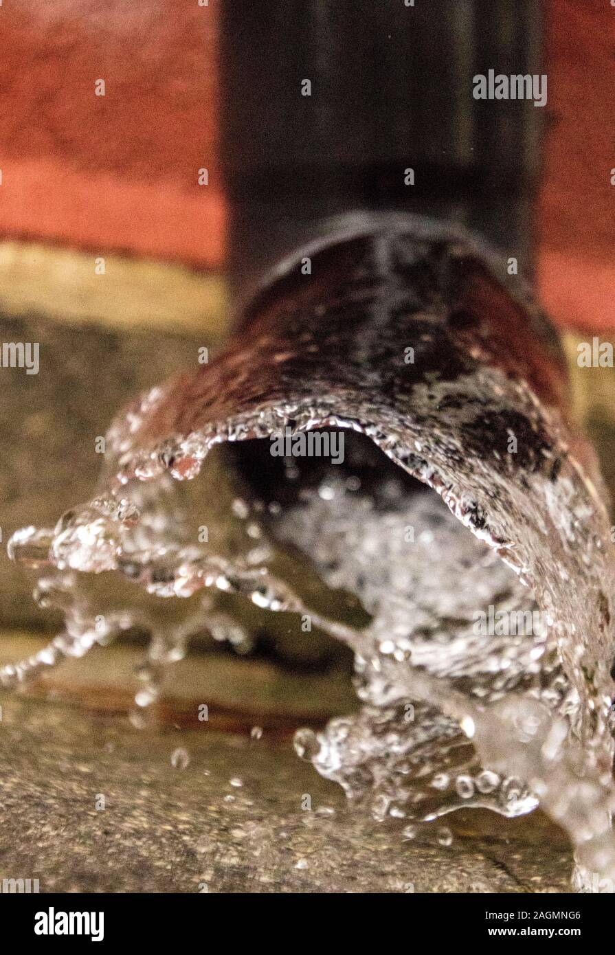 Gutters gush with water from a heavy downpour of rain Stock Photo - Alamy