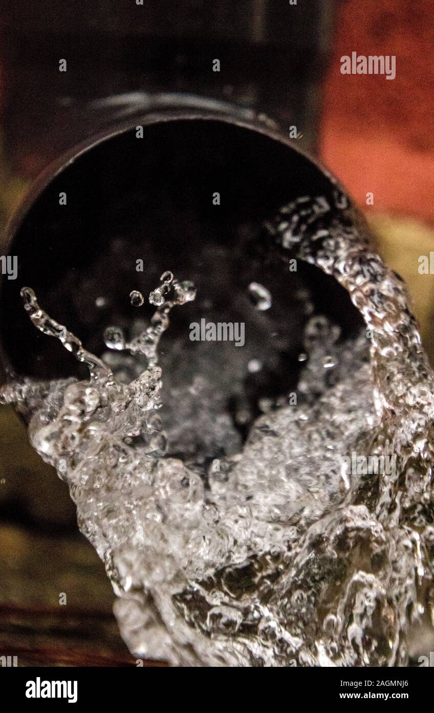 Gutters gush with water from a heavy downpour of rain Stock Photo - Alamy