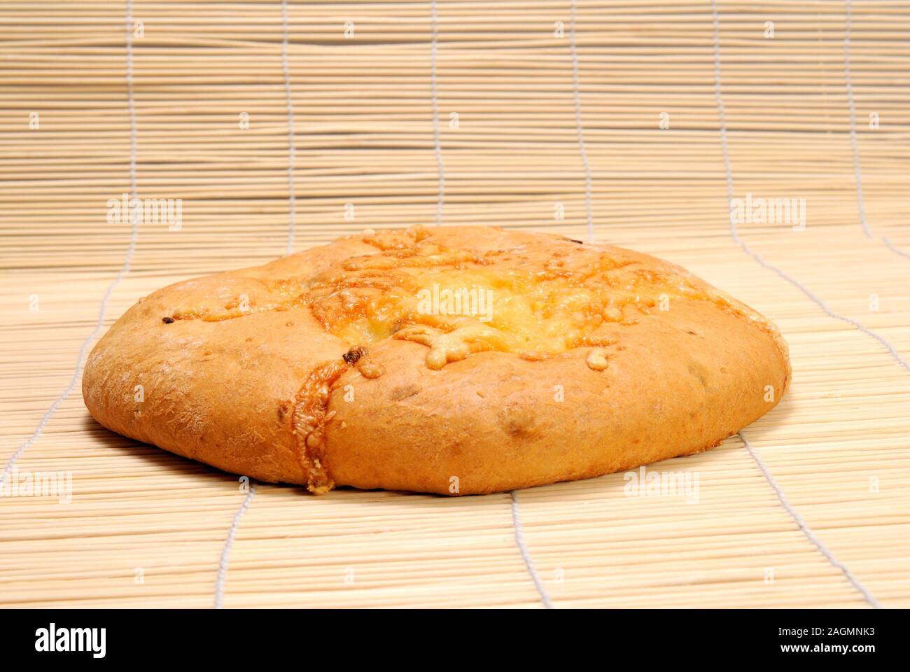 Round flat loaf of white bread with cheese Stock Photo - Alamy