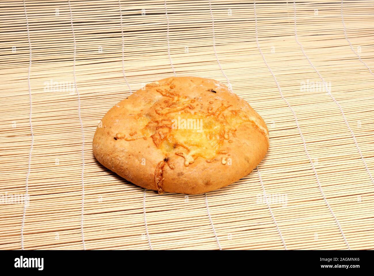 Round flat loaf of white bread with cheese Stock Photo - Alamy