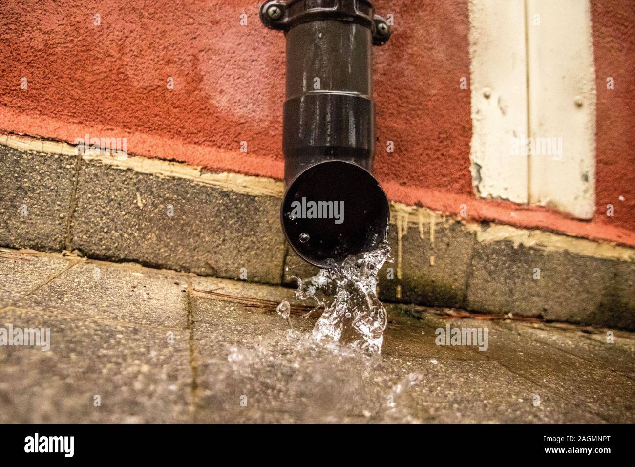 Gutters gush with water from a heavy downpour of rain Stock Photo - Alamy