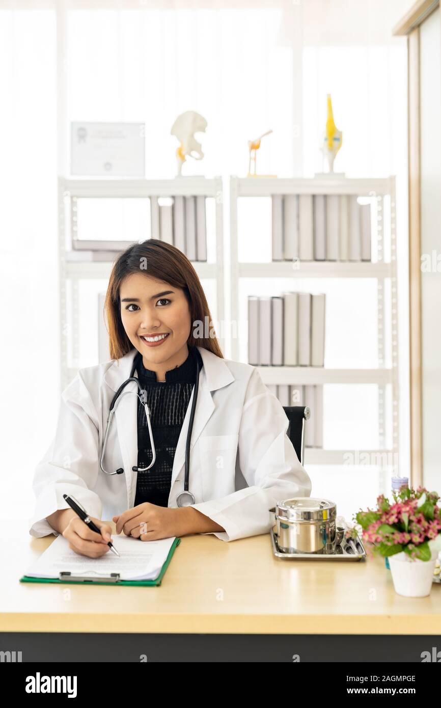 Portrait confident female doctor medical professional sitting in ...