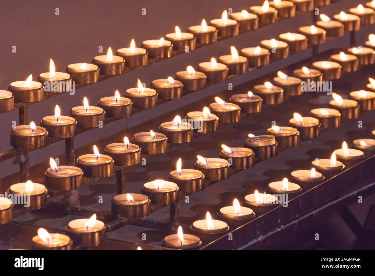 Candle lit in church remembrance hi-res stock photography and images ...