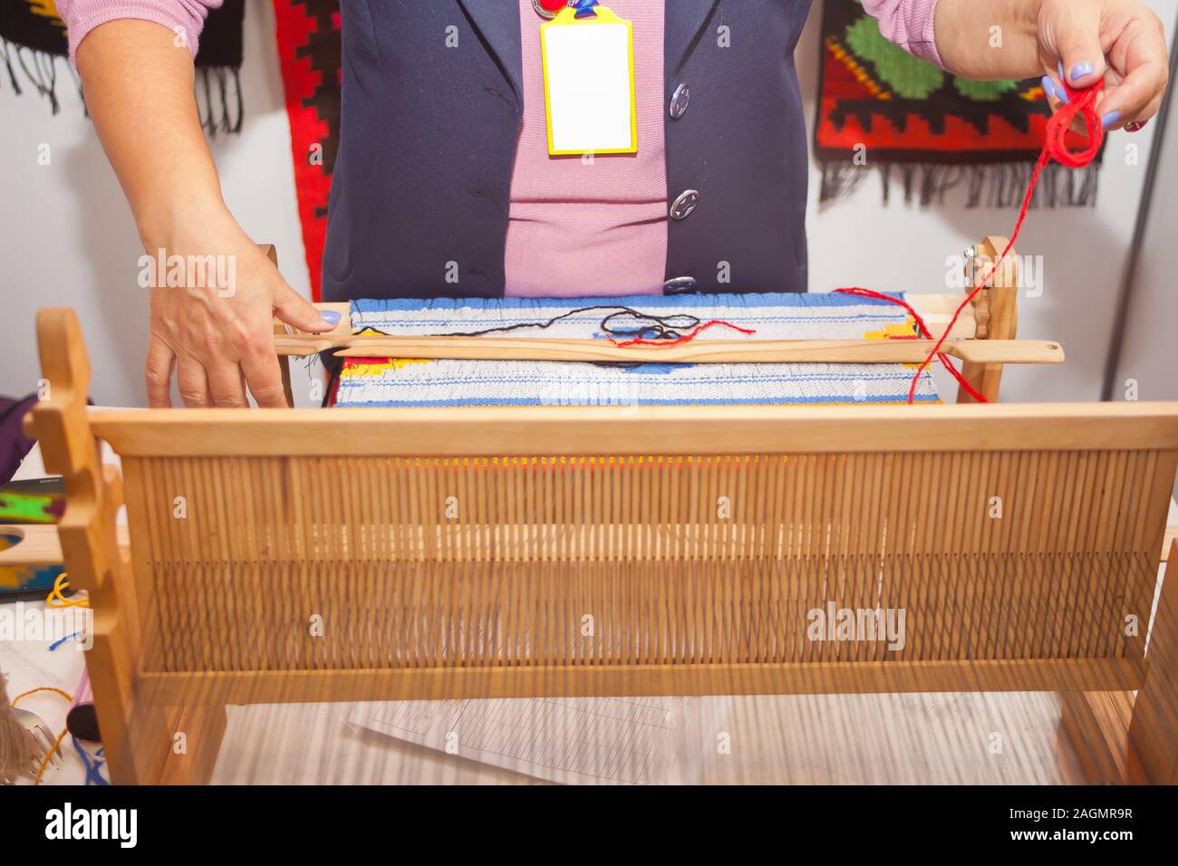 Woman hand weave on the weaving machine Stock Photo - Alamy