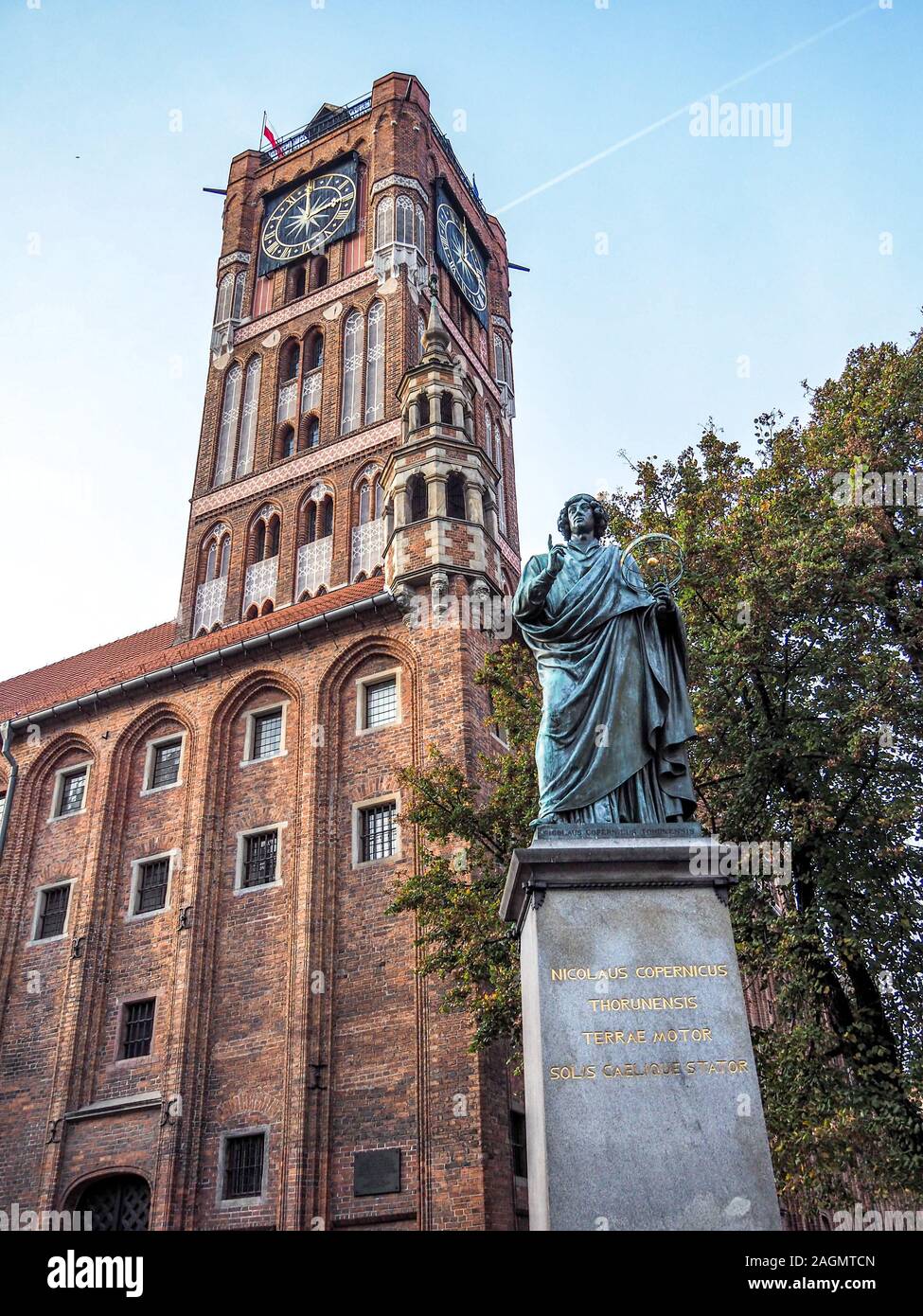 Copernicus statue in front of medieval town hall in Torun, Poland, the ...