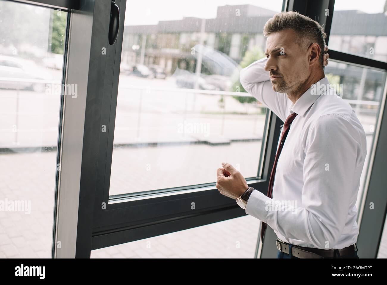 Standing by windows hi-res stock photography and images - Alamy