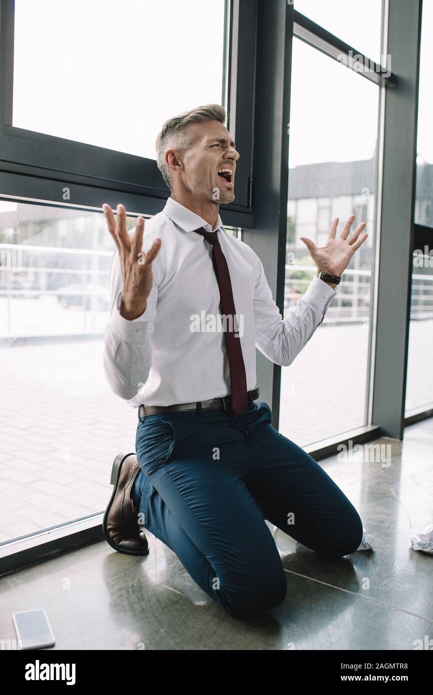 Frustrated angry man yelling sitting hi-res stock photography and ...