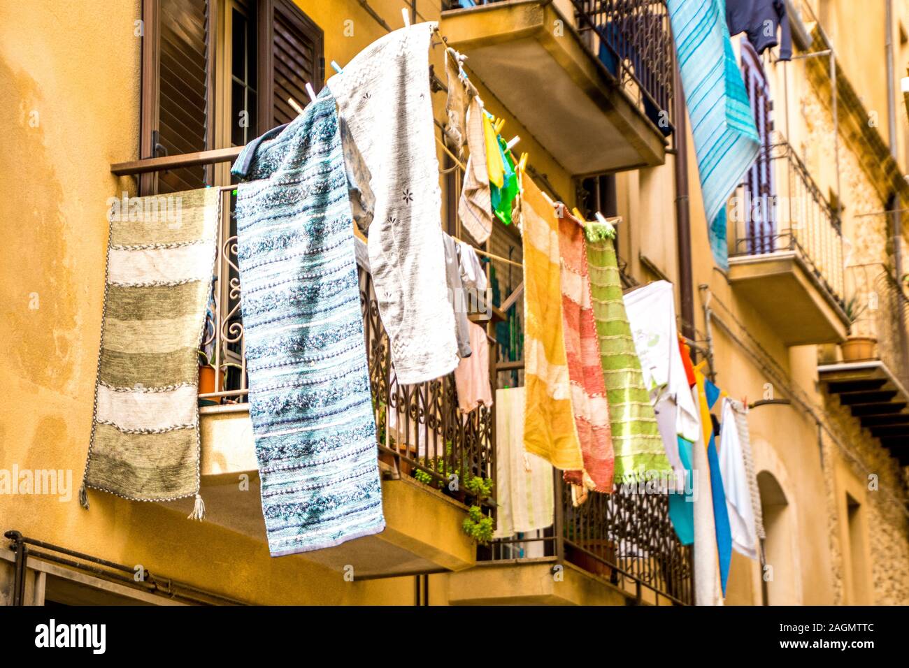 The traditional way of drying your washing in Italy Stock Photo - Alamy