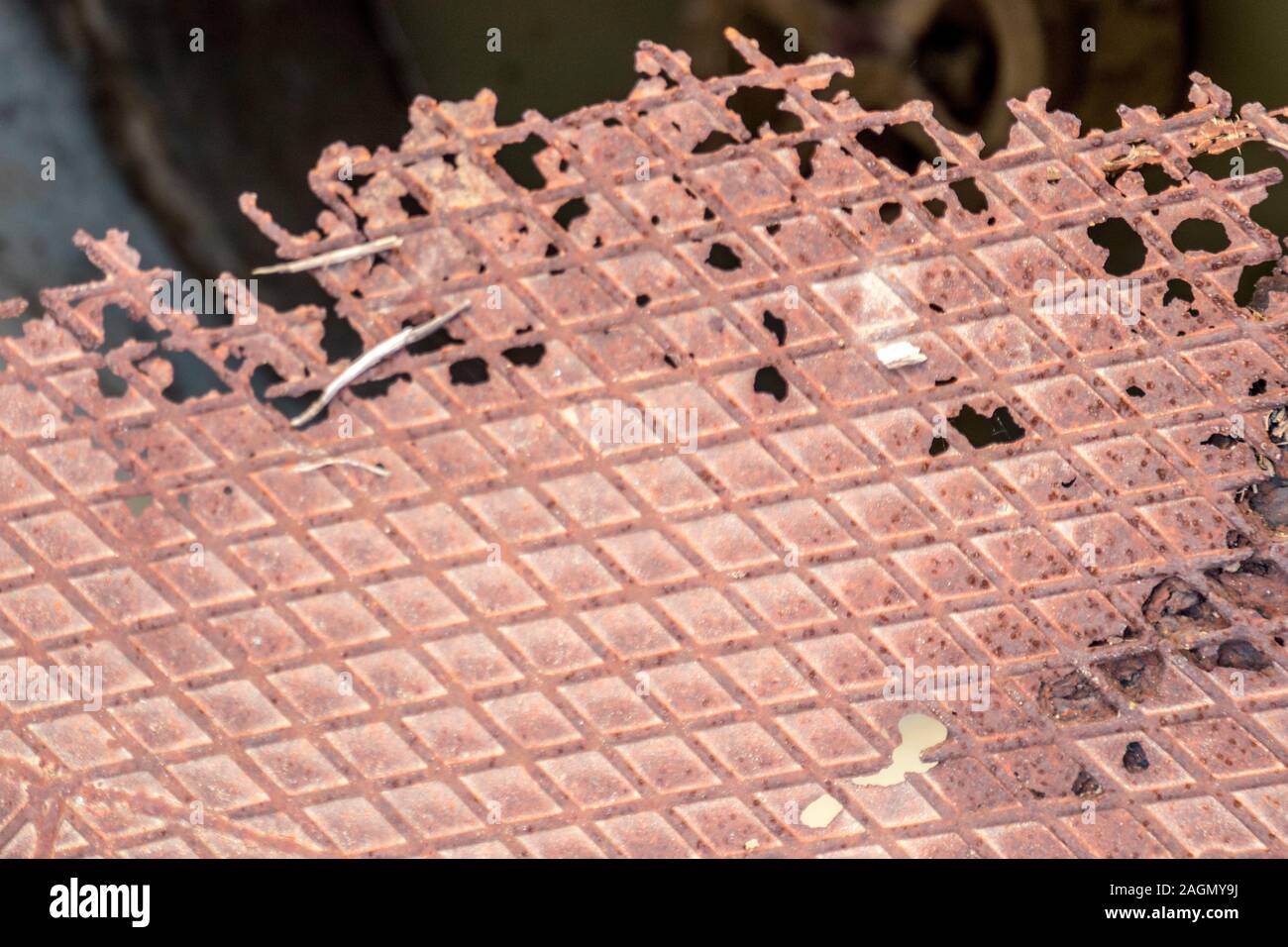 A very old and rusted manhole cover Stock Photo - Alamy