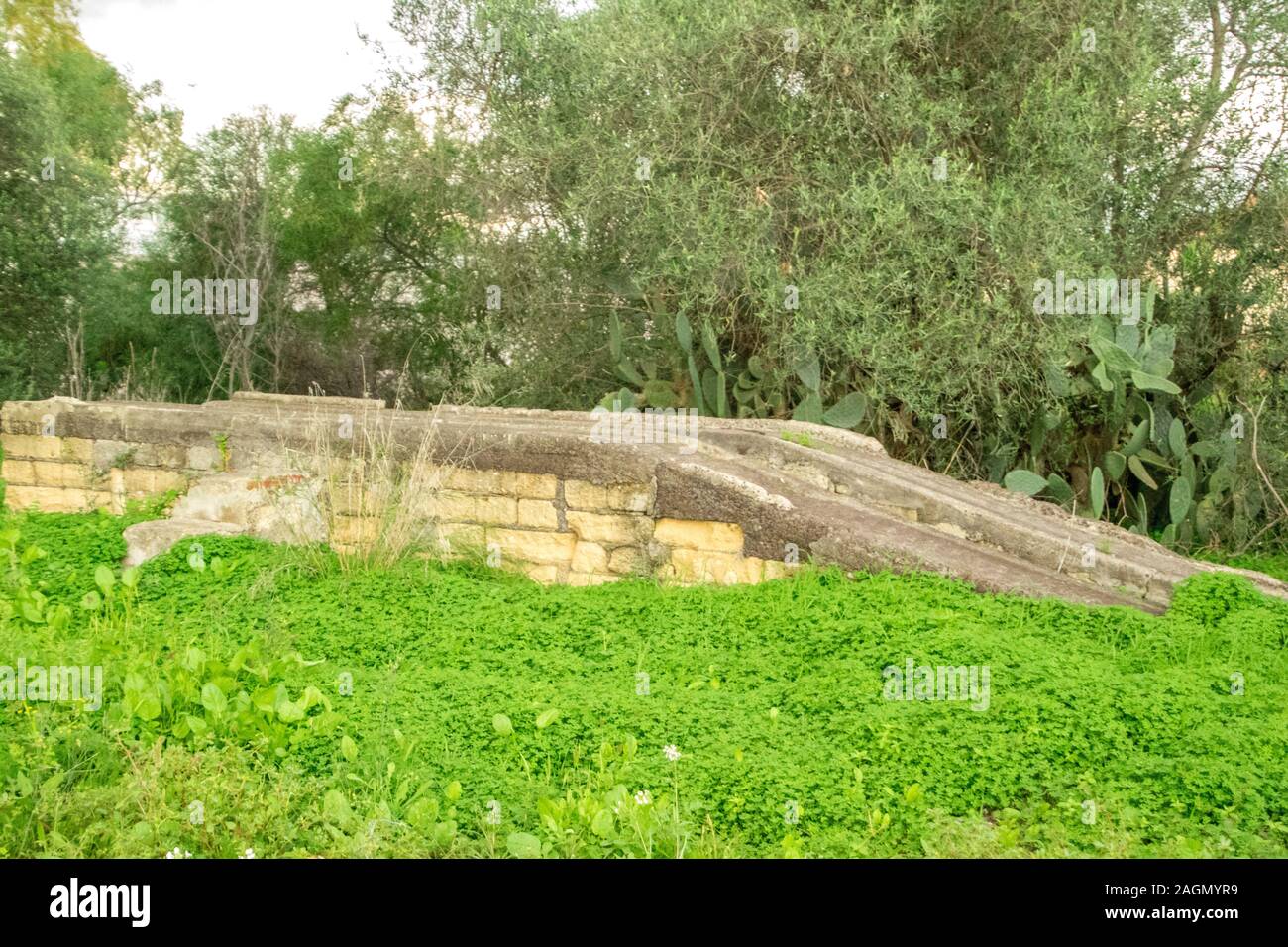 A very old stone vehicle ramp for inspecting cars etc Stock Photo - Alamy