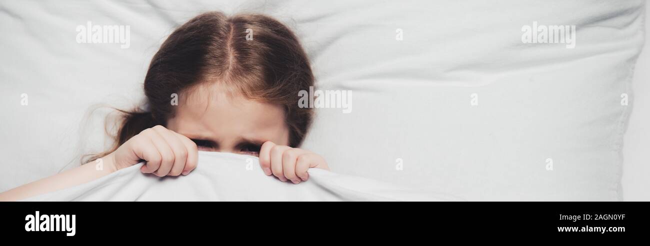 Scared child hiding hi-res stock photography and images - Alamy