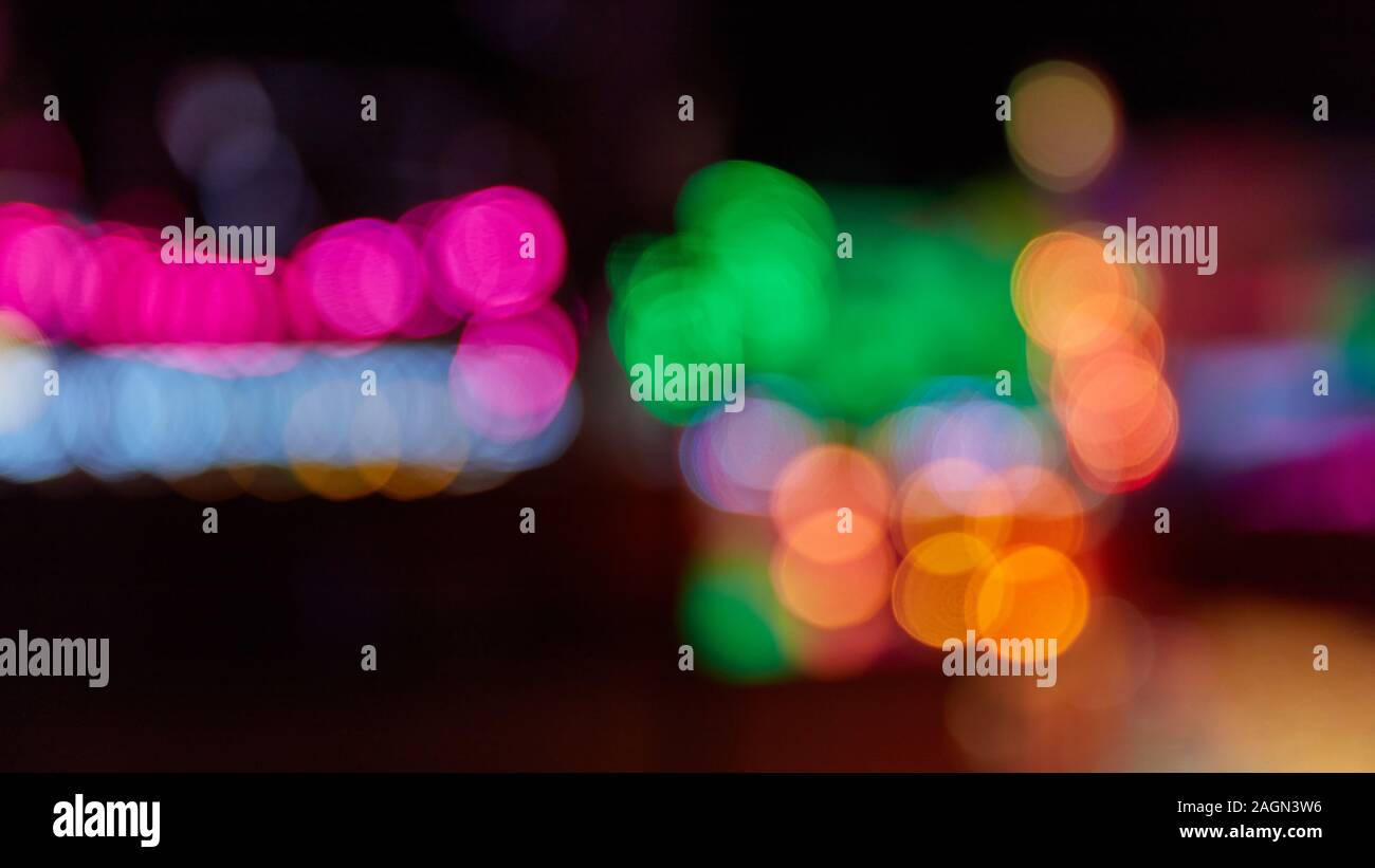 Colorful blurred bokeh lights at night at a fun fair or a fair Stock ...