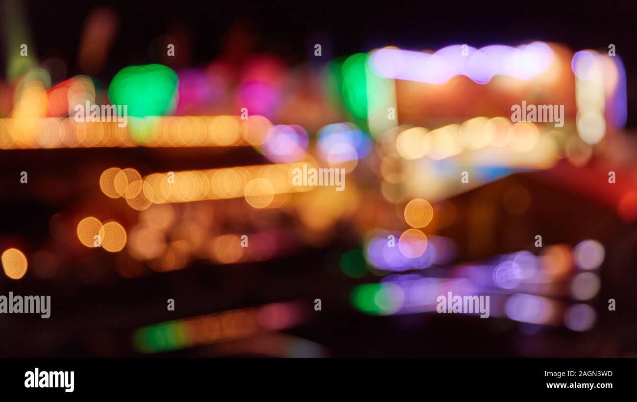 Abstract colorful bokeh lights background header with lights from fair ...