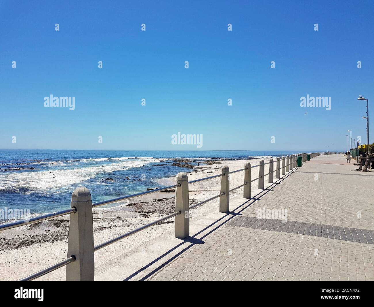 Mountains, hotels and deep blue water with waves at the Sea Point ...