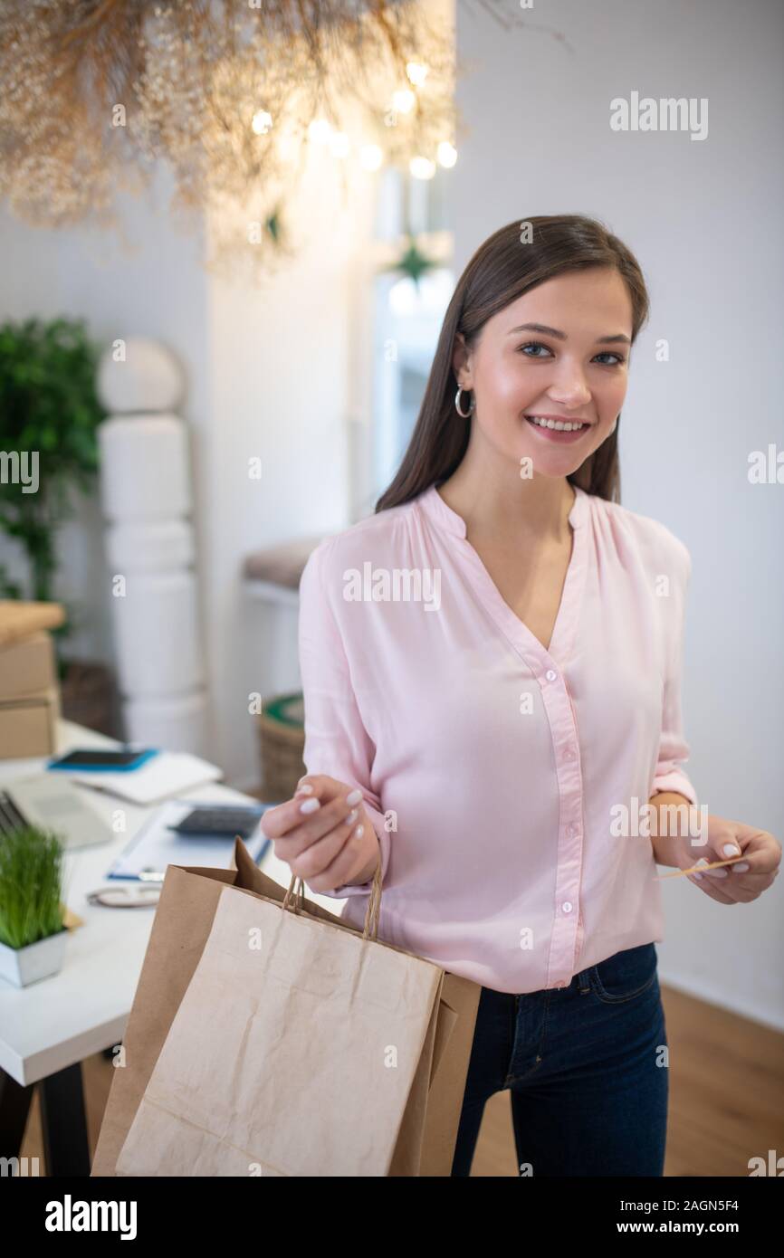 Woman returning clothes hi-res stock photography and images - Alamy