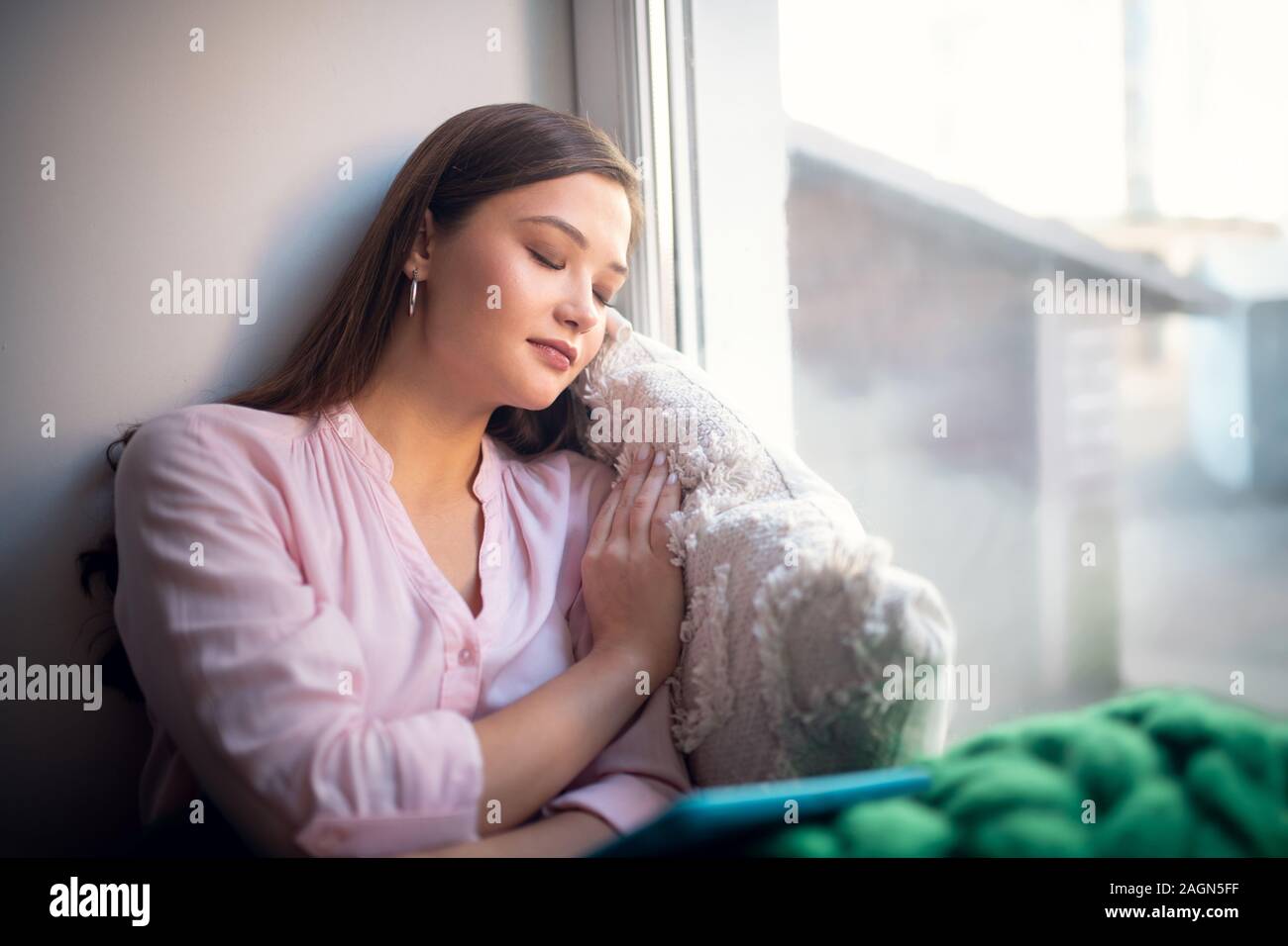 Leaning on windowsill hi-res stock photography and images - Alamy