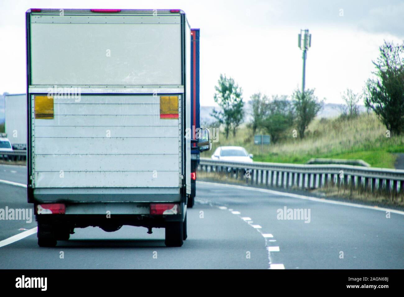 A lorry transporting goods of all sorts, traveling along a main UK ...