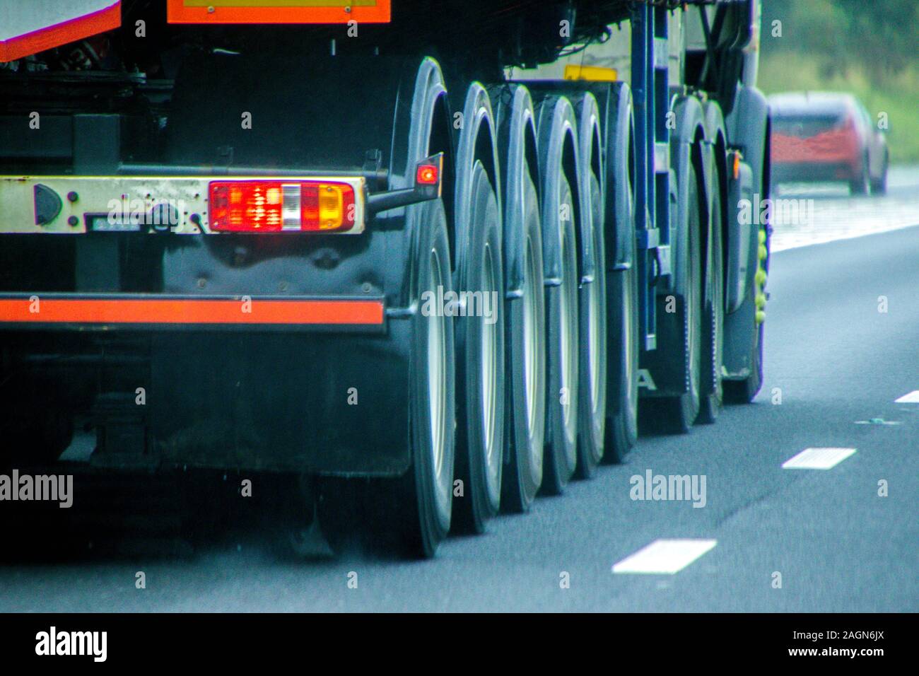 A closeup of wheels in motion from an articulated lorry, traveling ...